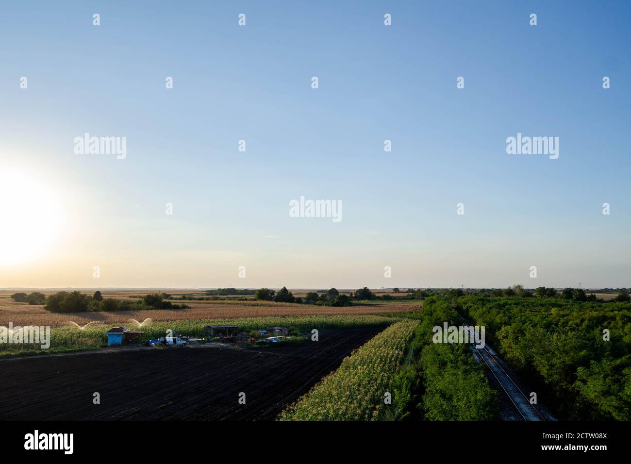 Landscape view of farmland, train tracks on the side Stock Photo - Alamy