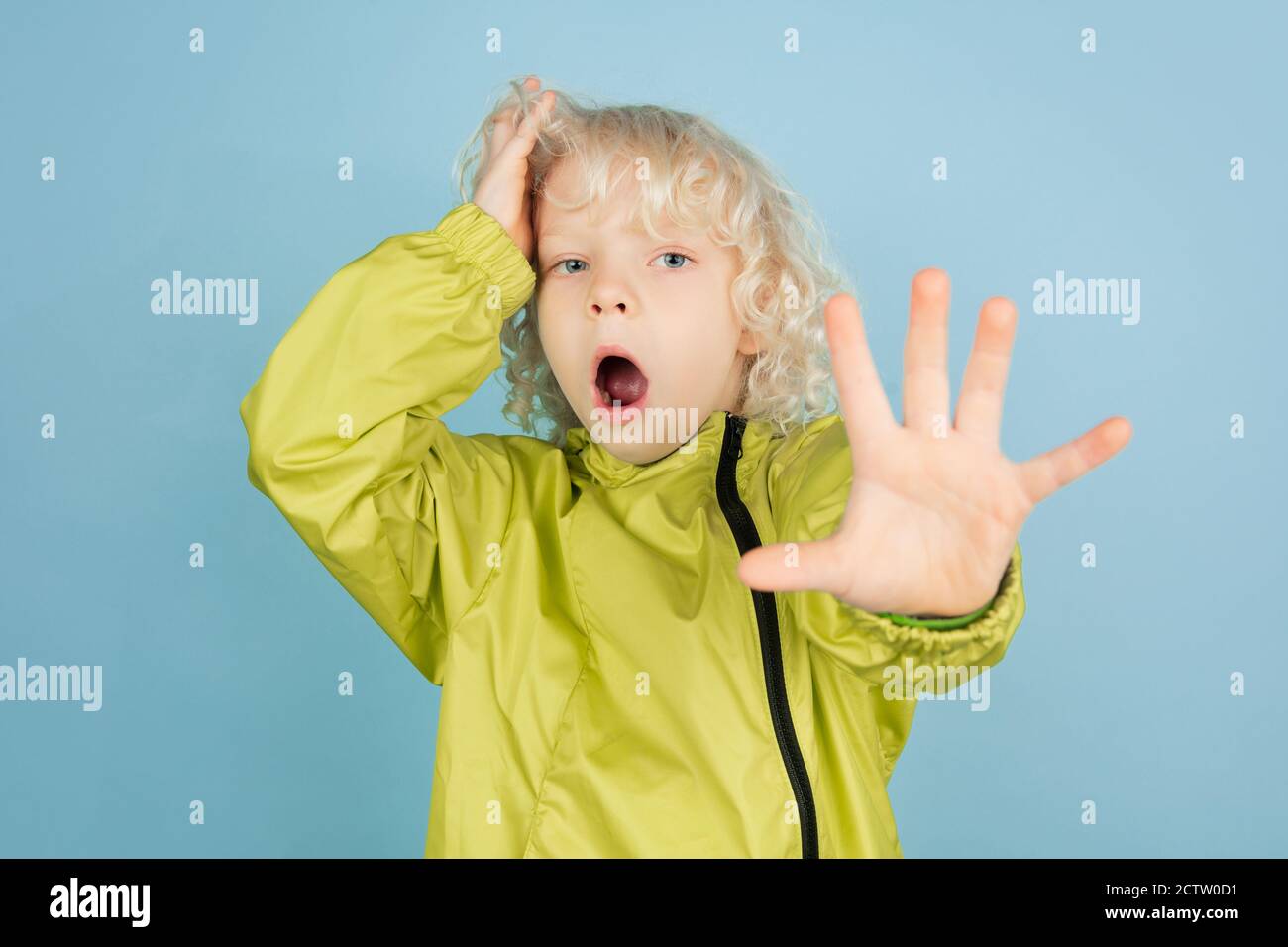 Shocked, scared. Portrait of beautiful caucasian little boy isolated on ...