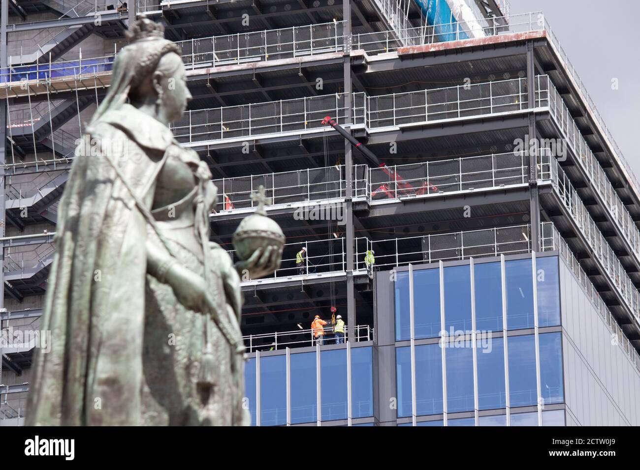 The statue of Queen Victoria situated in Victoria Square is dwarfed by ...