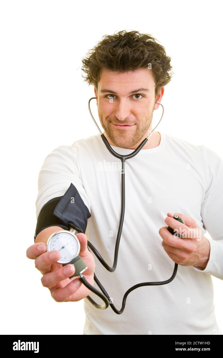 Young man measures his blood pressure himself Stock Photo - Alamy