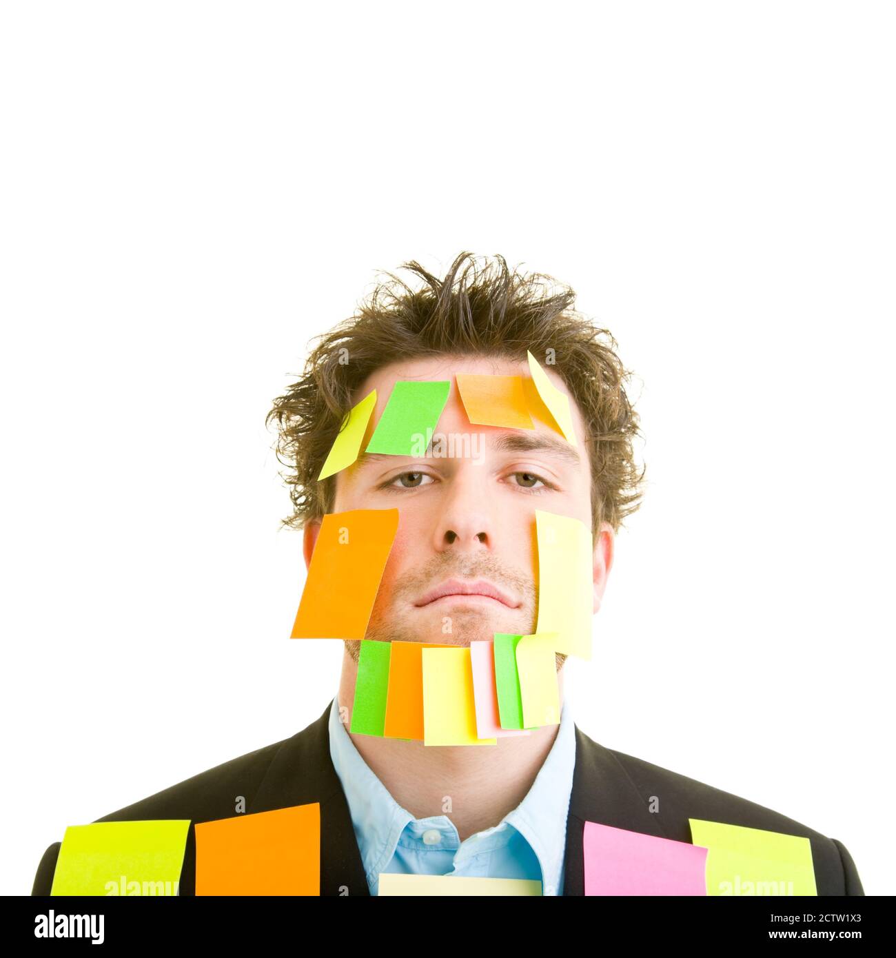 Young man in suit with lots of sticky notes on his face and body Stock ...