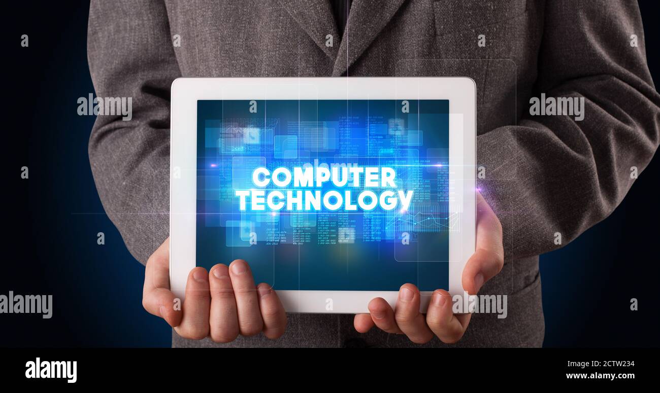 Young business person working on tablet and shows the inscription ...