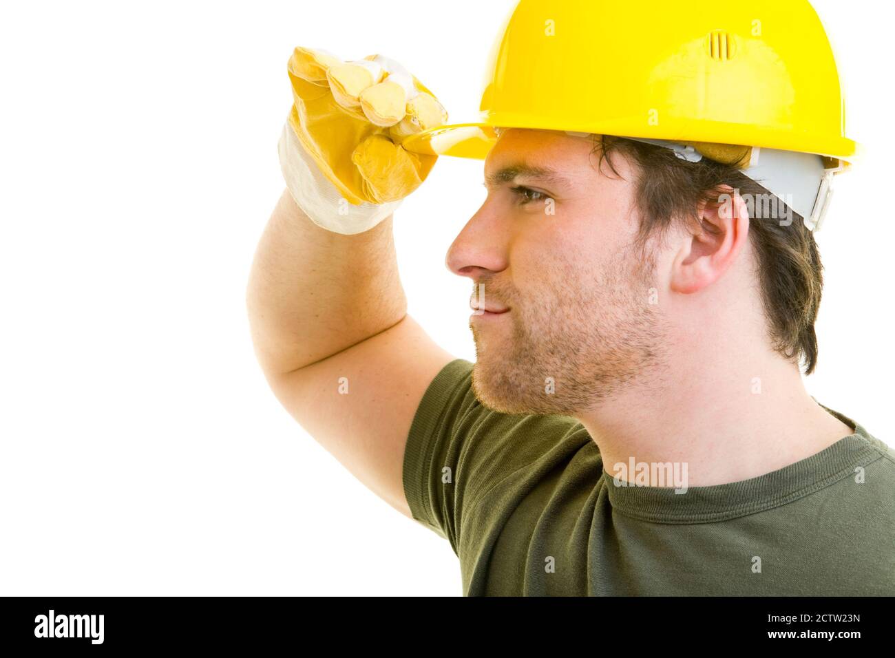 Construction worker with helmet looks into the distance Stock Photo - Alamy