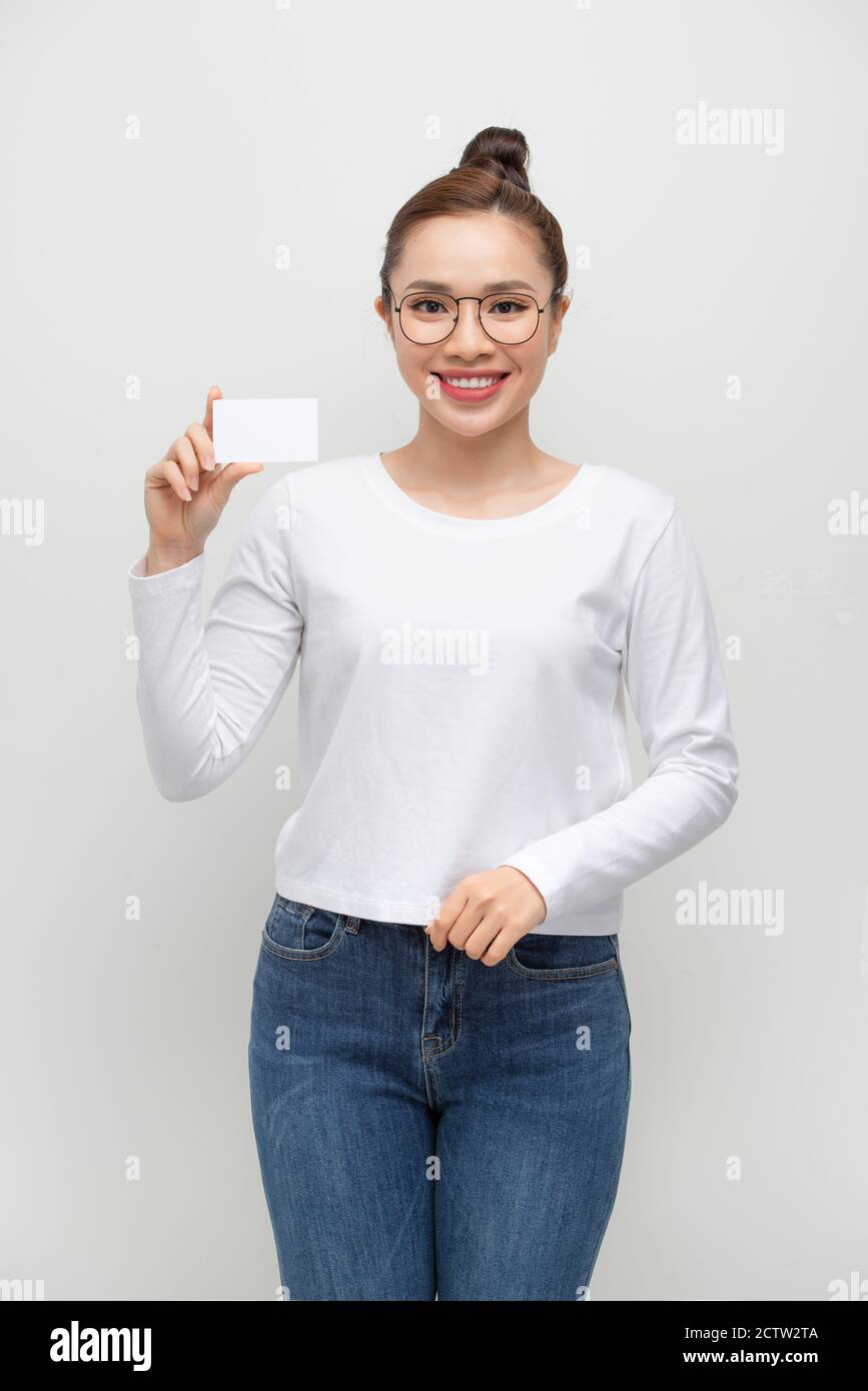 Young smiling woman show blank card. Girl portrait isolated on white ...