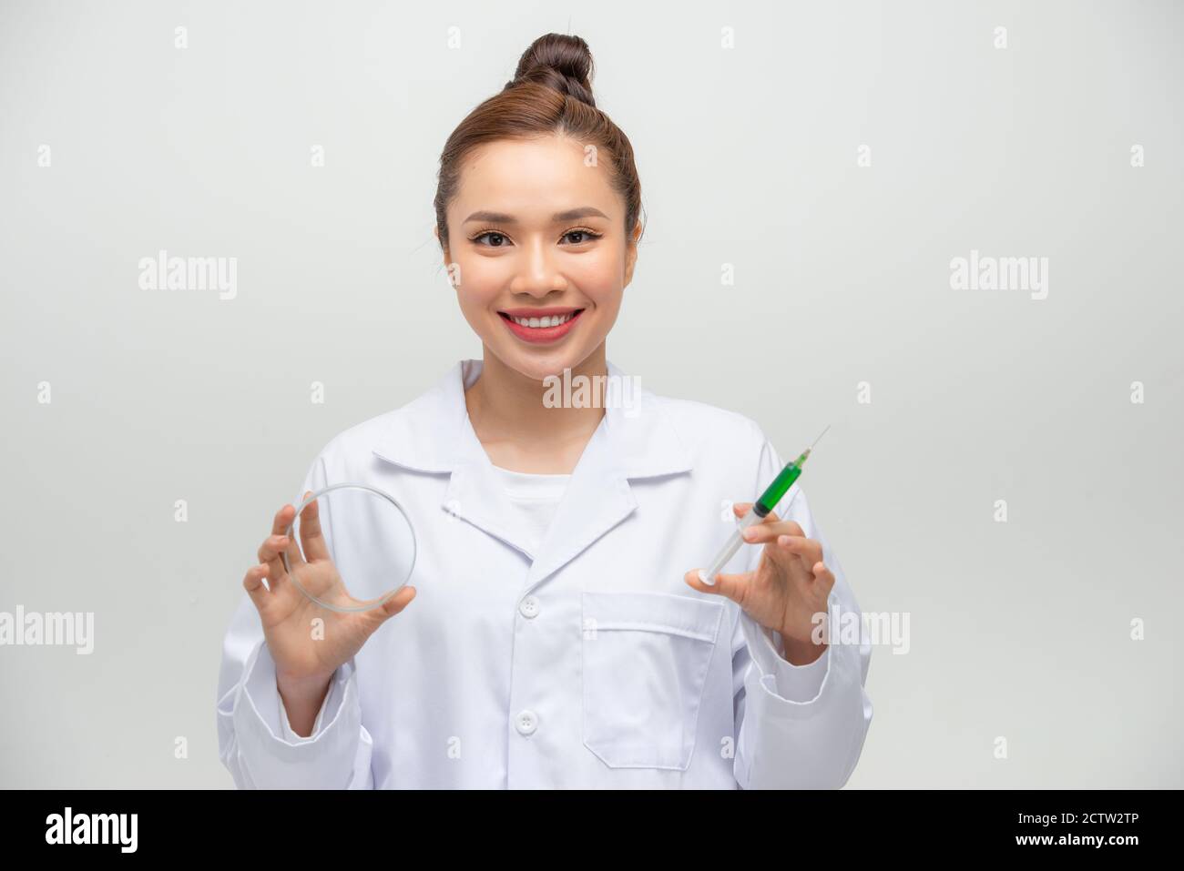 Female scientist testing experiment in a science lab where she looking ...