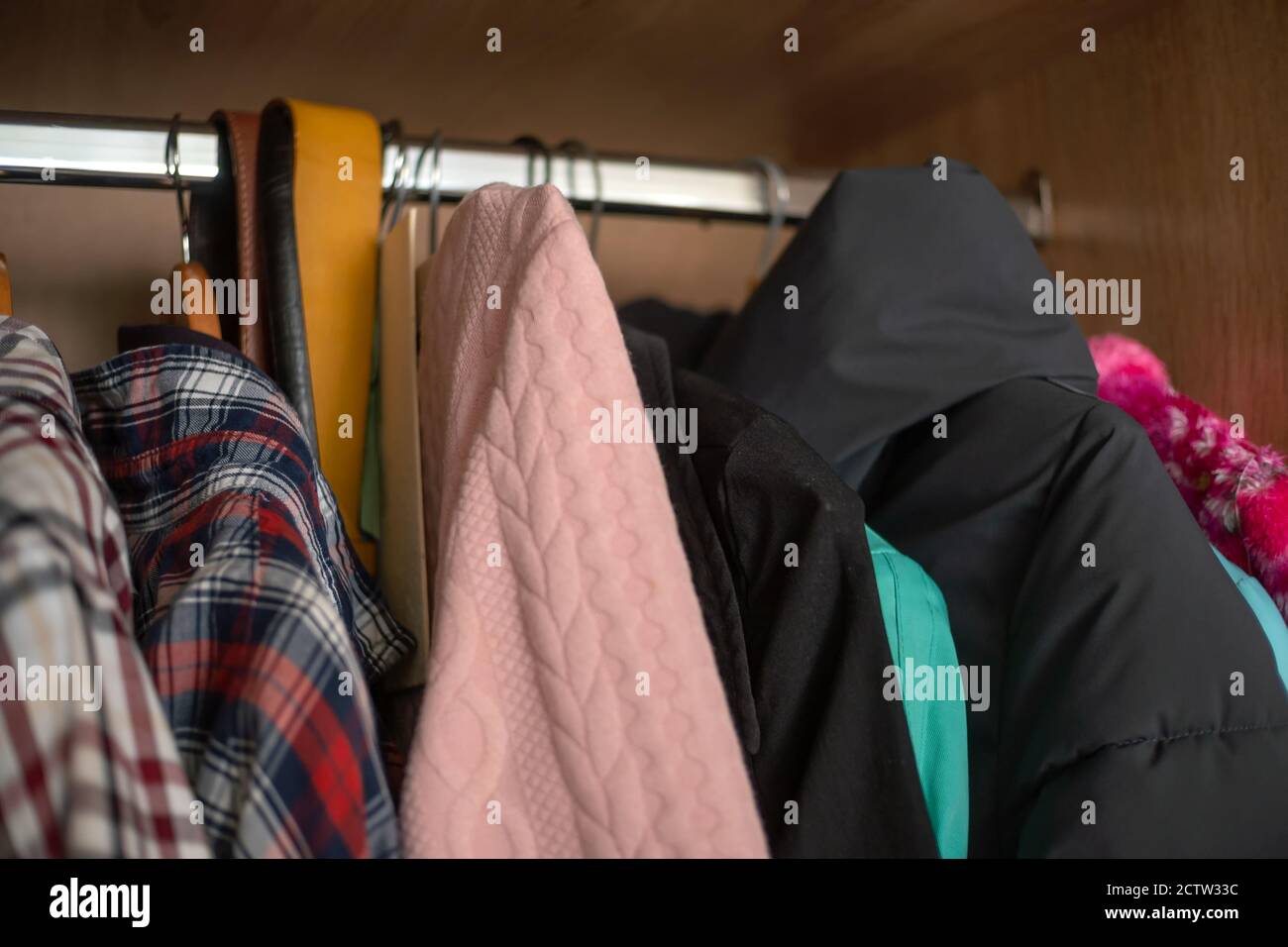 Open wardrobe with clothes close up Stock Photo - Alamy