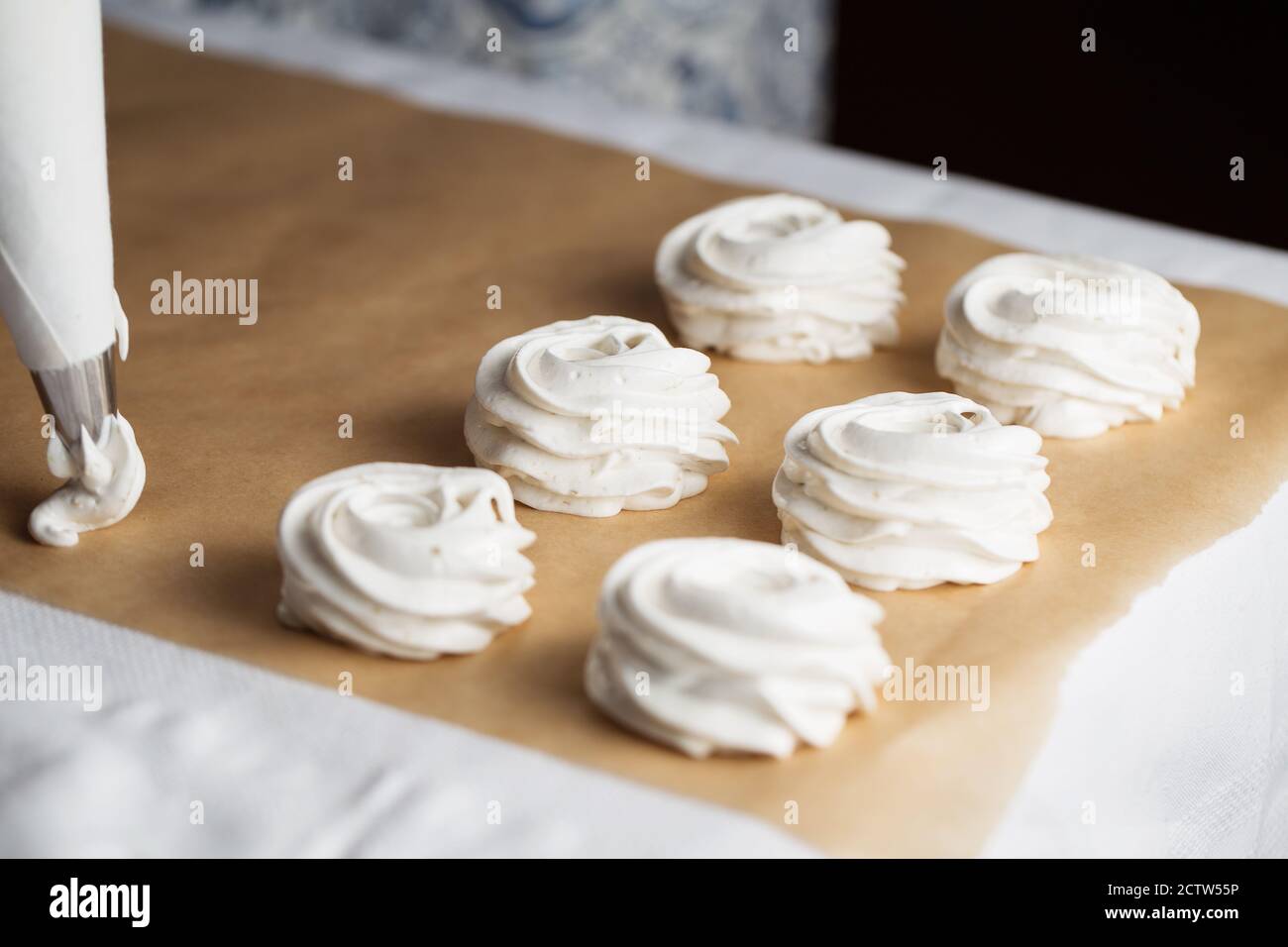 The process of making marshmallow. Close up hands of the chef with ...