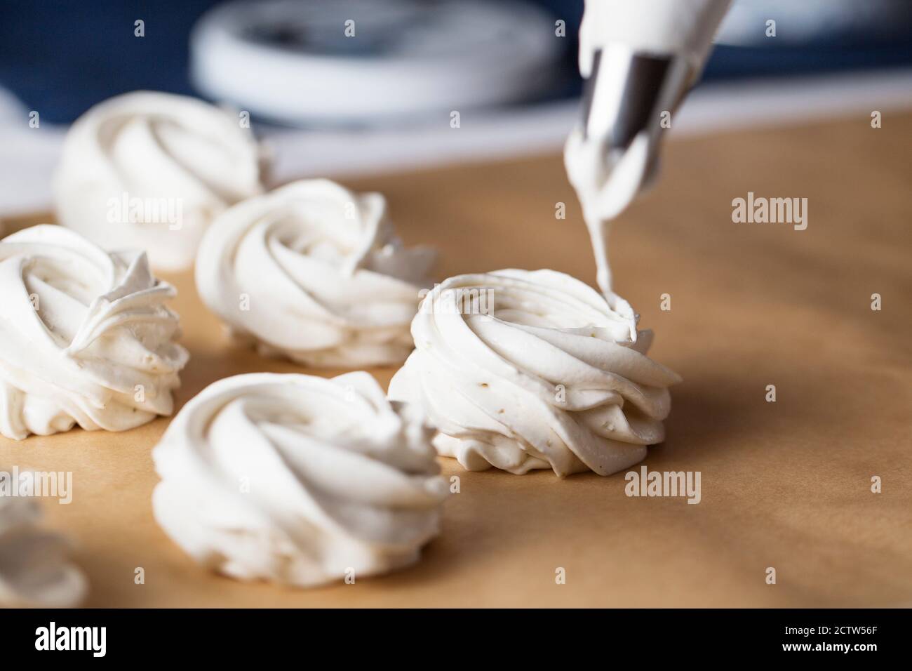 The process of making marshmallow. Close up hands of the chef with ...