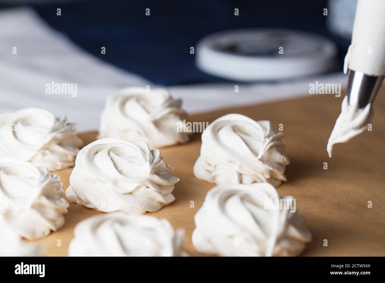 The process of making marshmallow. Close up hands of the chef with ...