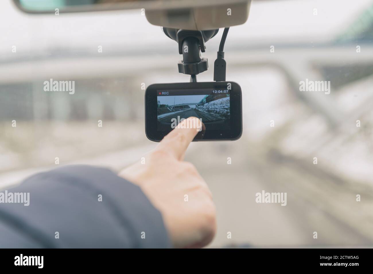 Using dashboard camera to continuously record a view through a vehicle ...