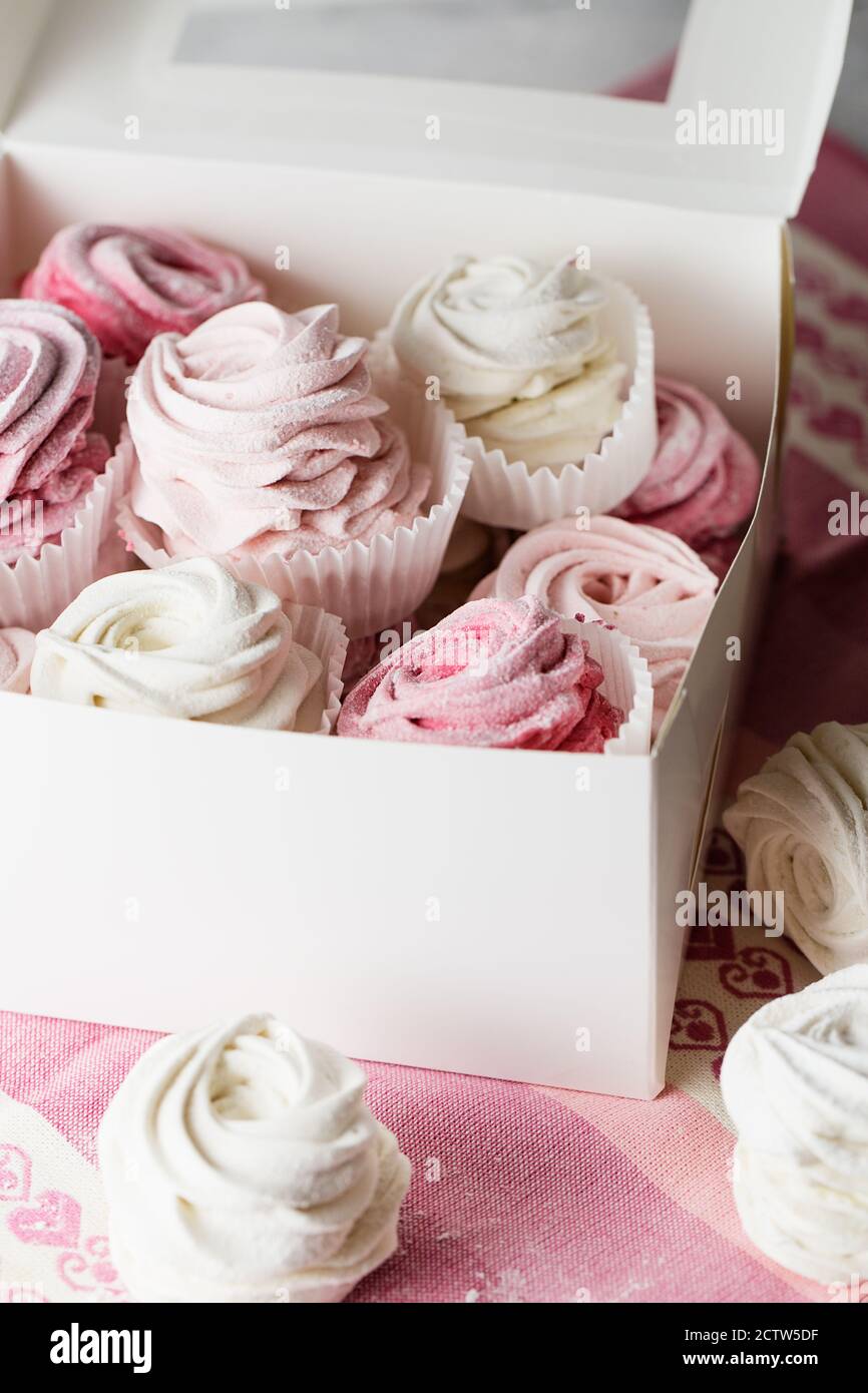 Sweet dessert zephyr marshmallows close up. Big zephyr sprinkled with ...