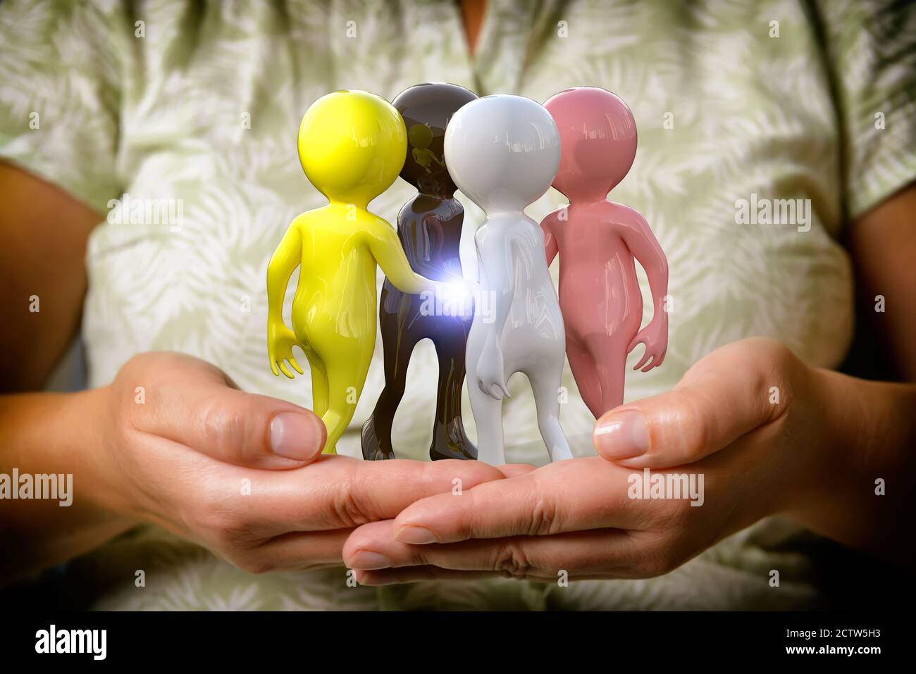 Men of different races stand in a circle on a woman's hands. Concept of ...