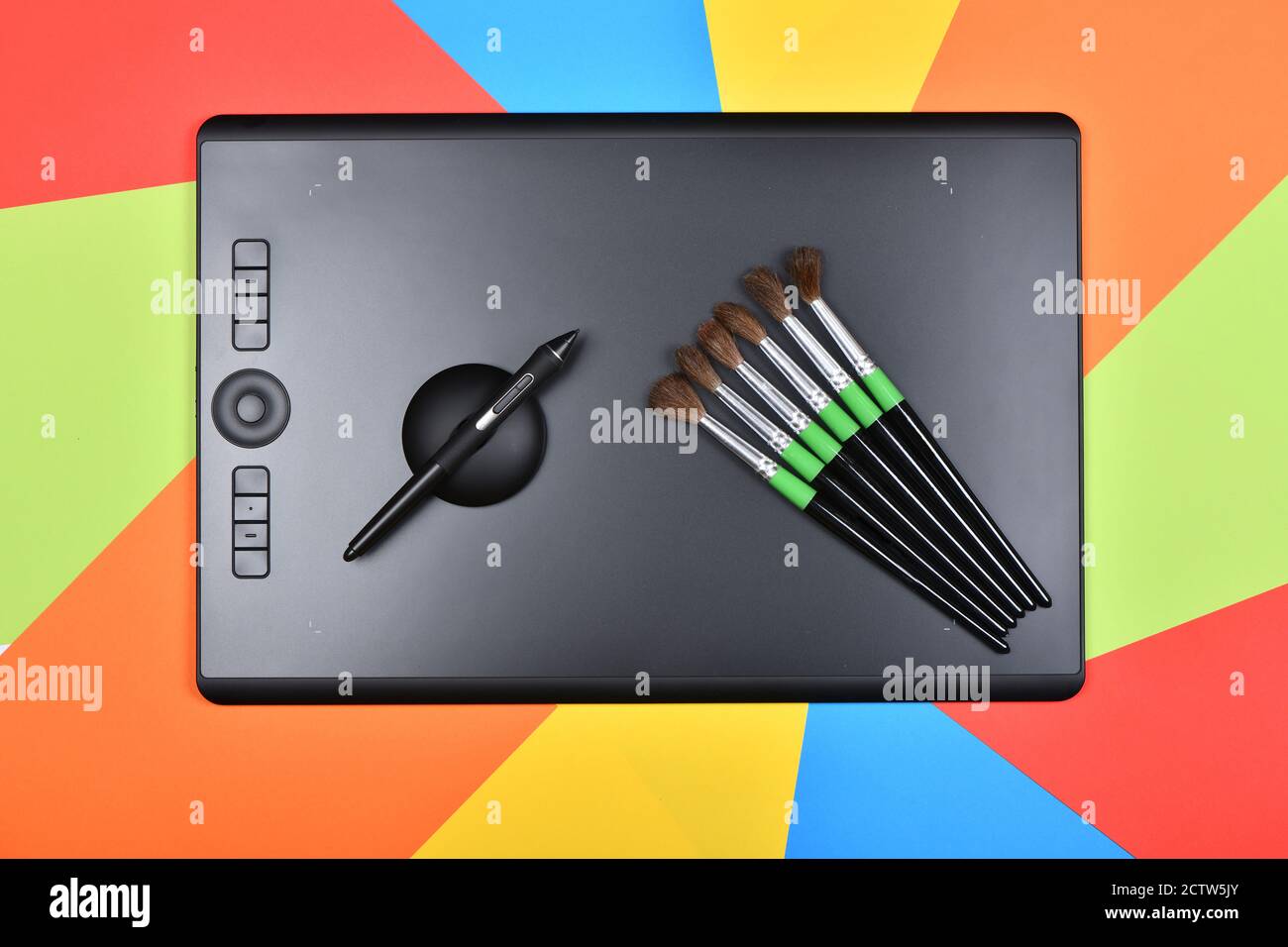 Top view professional graphics tablet with paintbrushes and digitized ...
