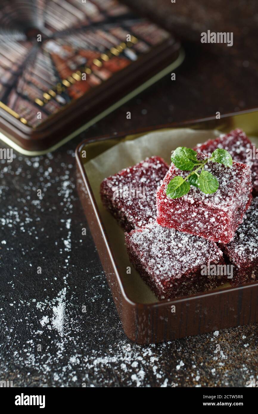 Homemade multicolored marmalade candy in sugar on dark background ...