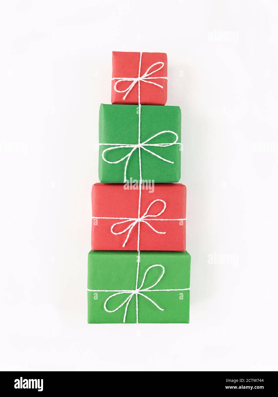 Christmas tree shape from red and green gift boxes on a white ...