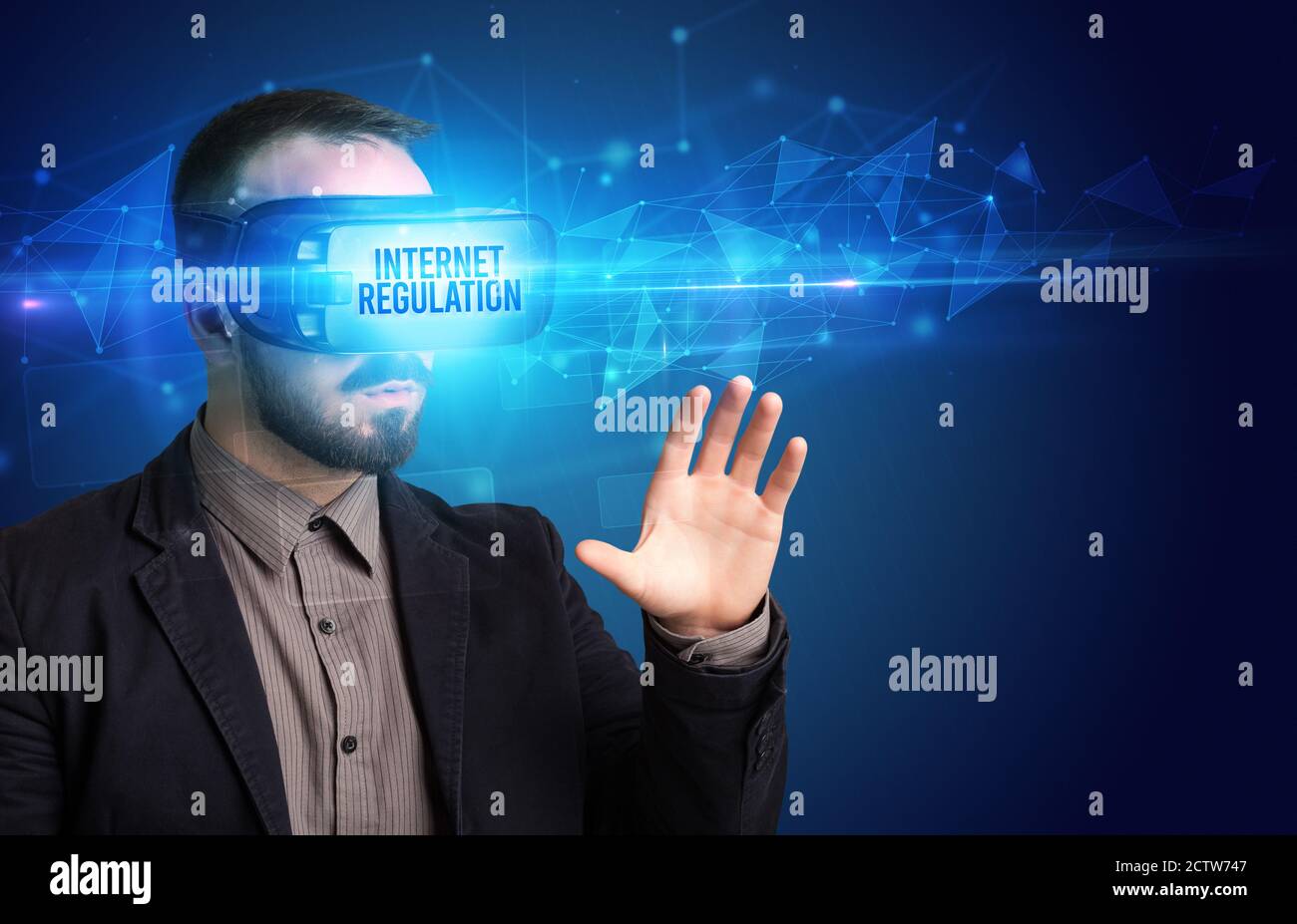 Businessman looking through Virtual Reality glasses with INTERNET ...