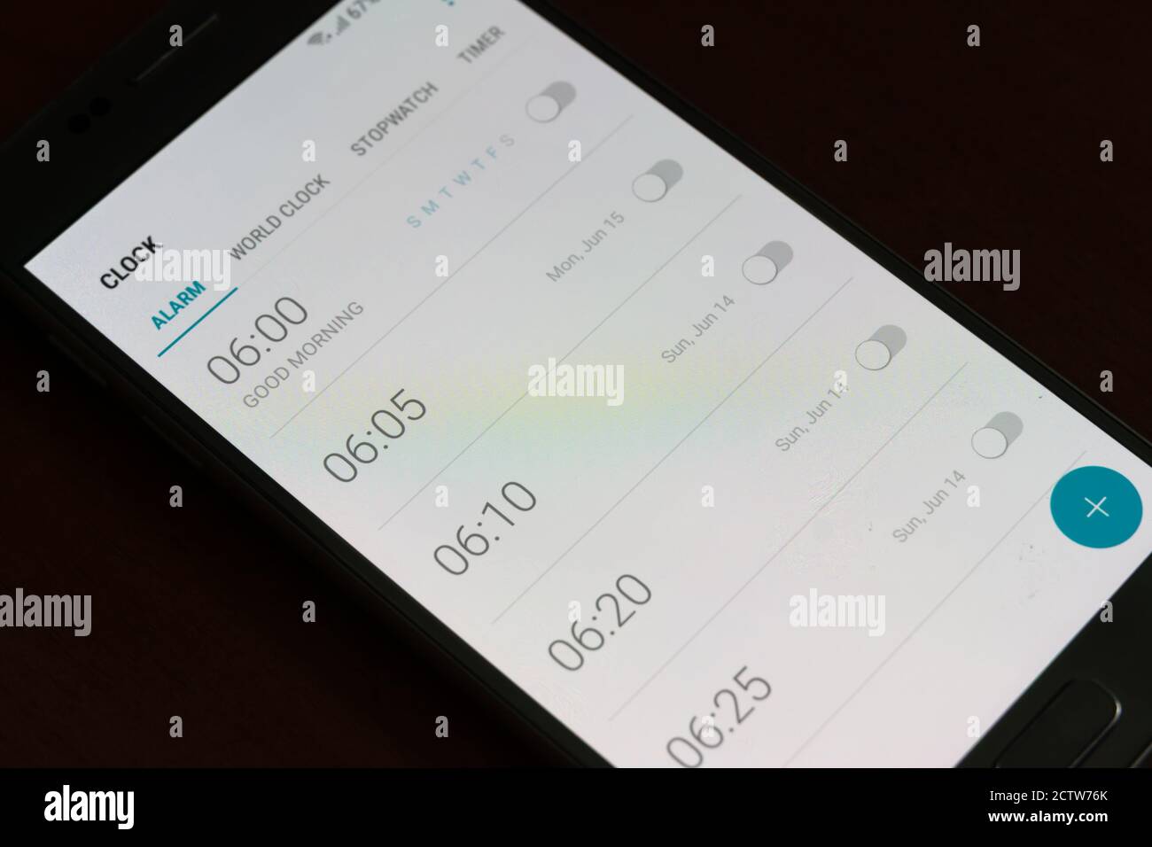 Smartphone screen with alarms turned off for every day close-up ...