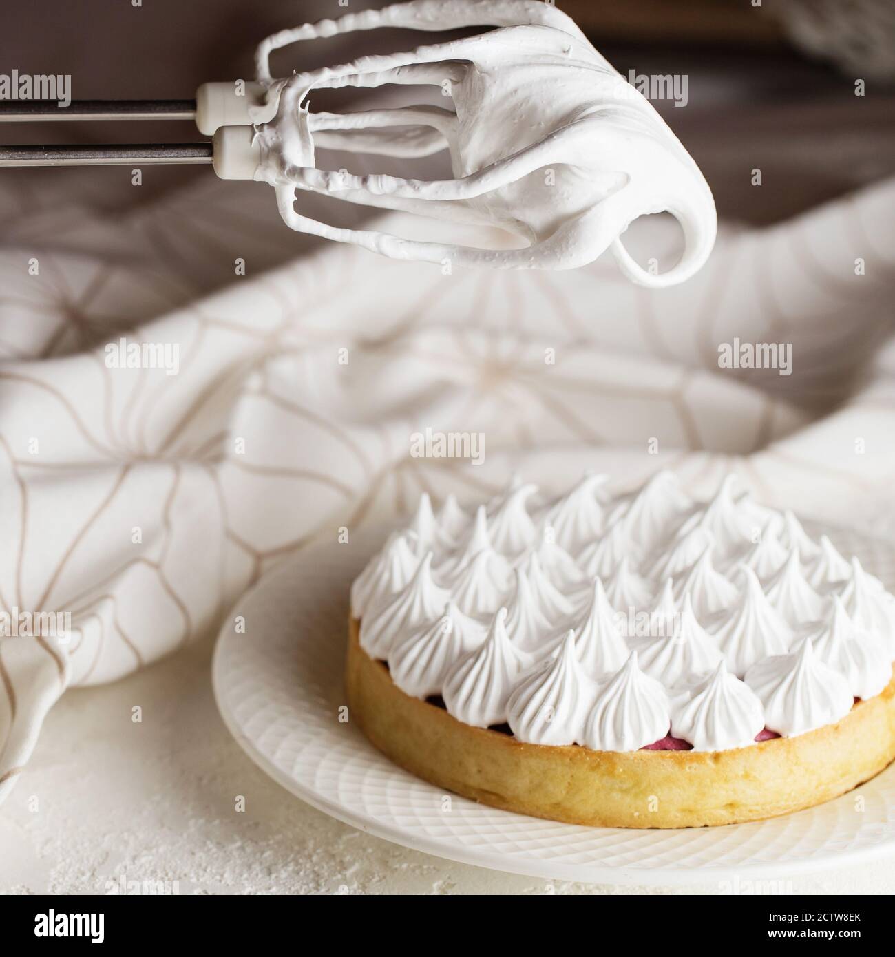 Beautiful freshly made white lemon meringue tart on plate. Lemon ...