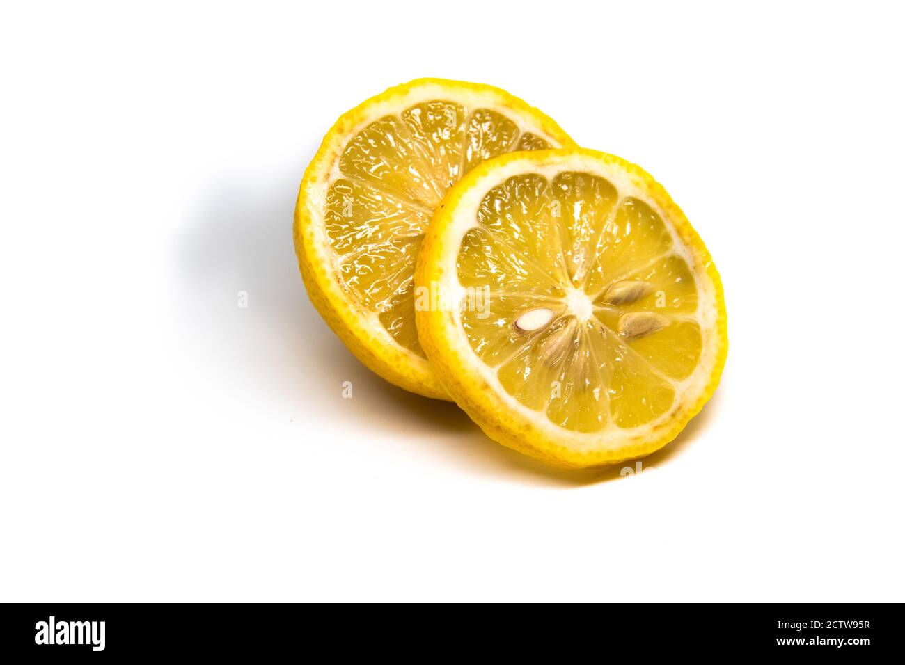 Fresh lemon with half and leaves isolated on white Stock Photo - Alamy