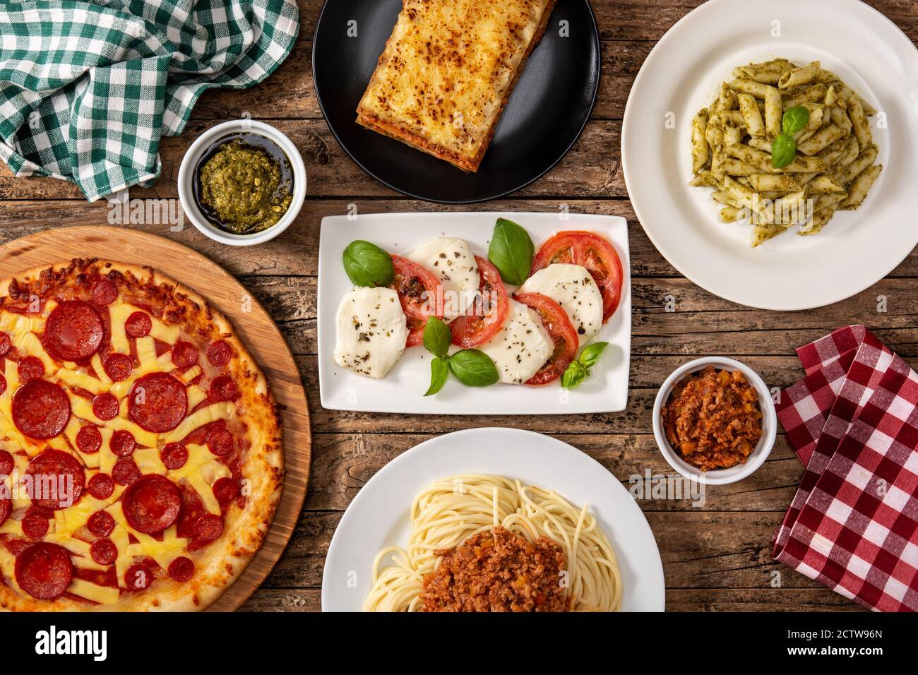 Assortment of Italian pasta dishes on wooden table Stock Photo - Alamy