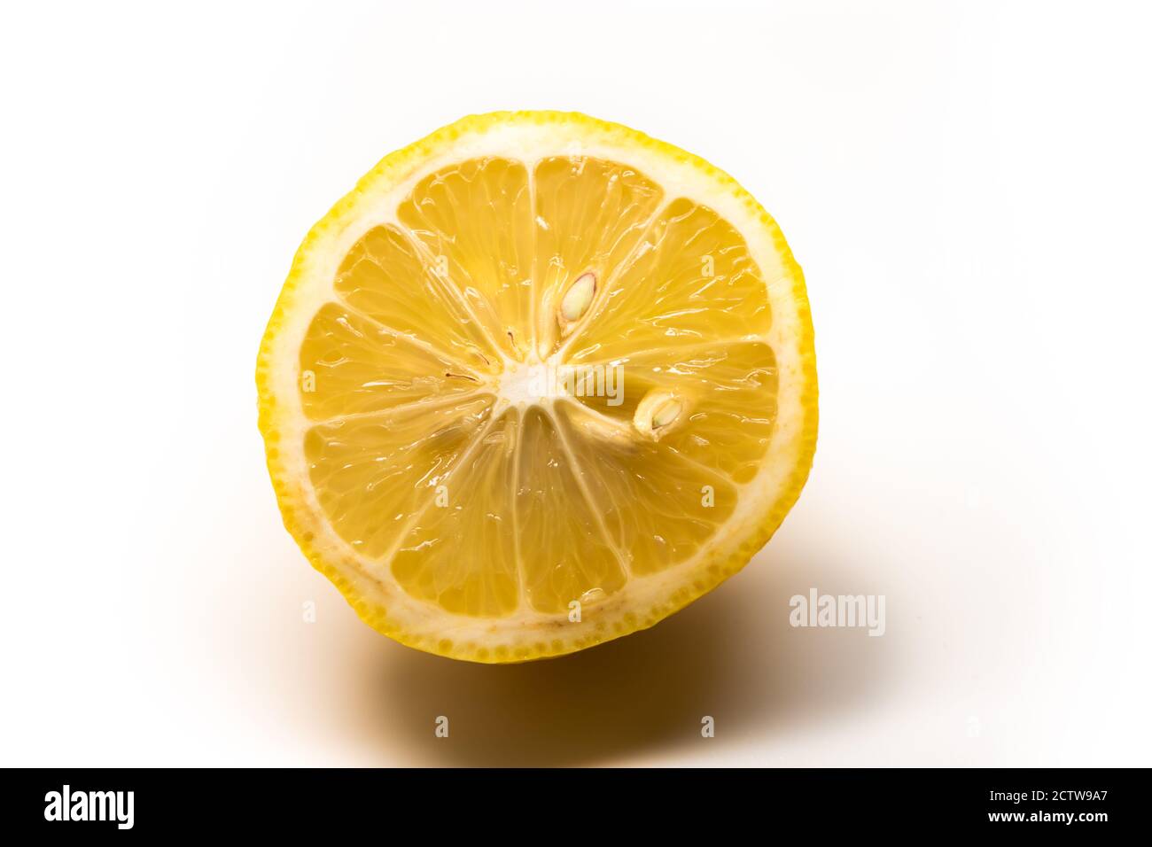 Fresh lemon with half and leaves isolated on white Stock Photo - Alamy