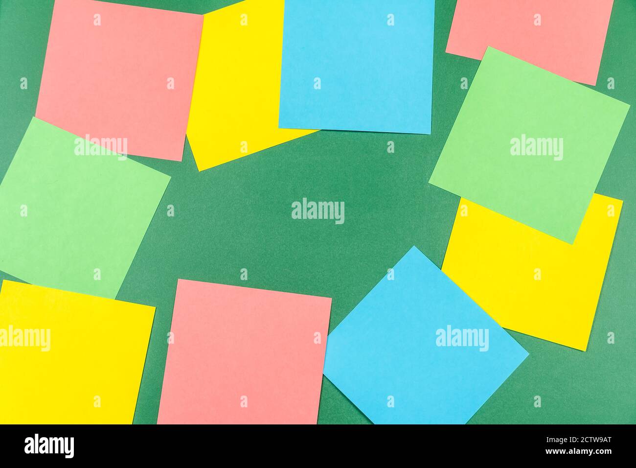 Lots of colorful note sheets on a green background, space for copying ...