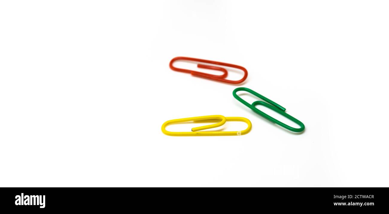 Red paper clip attached to multiple sheets of paper Stock Photo - Alamy