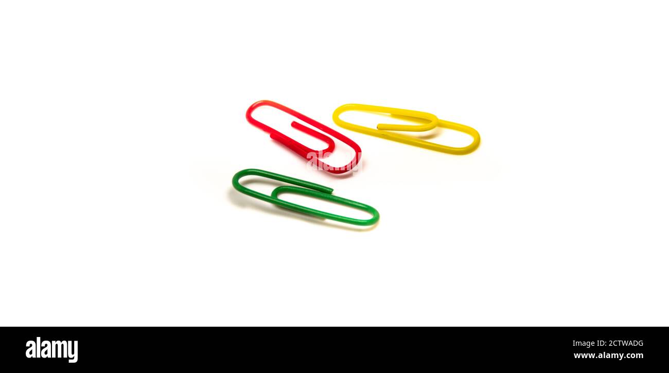 Red paper clip attached to multiple sheets of paper Stock Photo - Alamy