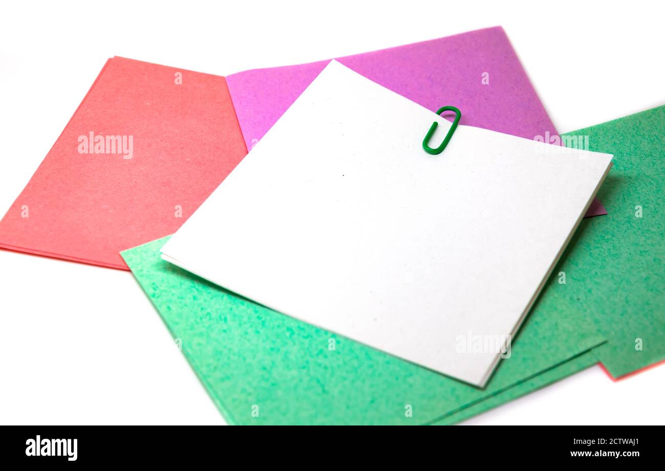 Red paper clip attached to multiple sheets of paper Stock Photo - Alamy