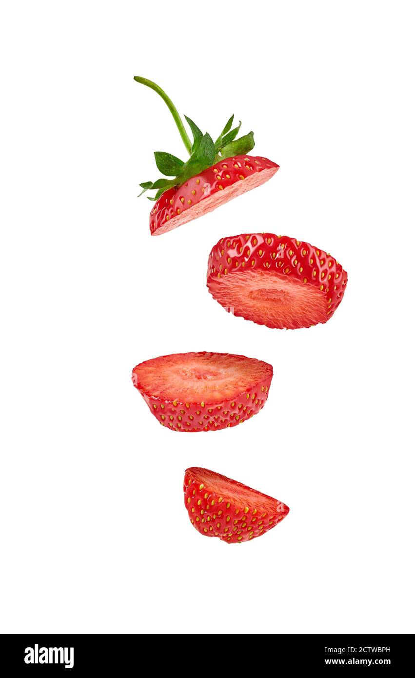 Falling sliced strawberry isolated on white background. Summer harvest ...