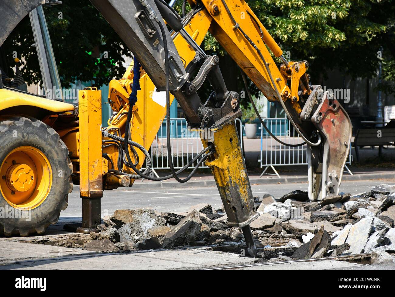 Breaking the asphalt on the road construction Stock Photo - Alamy