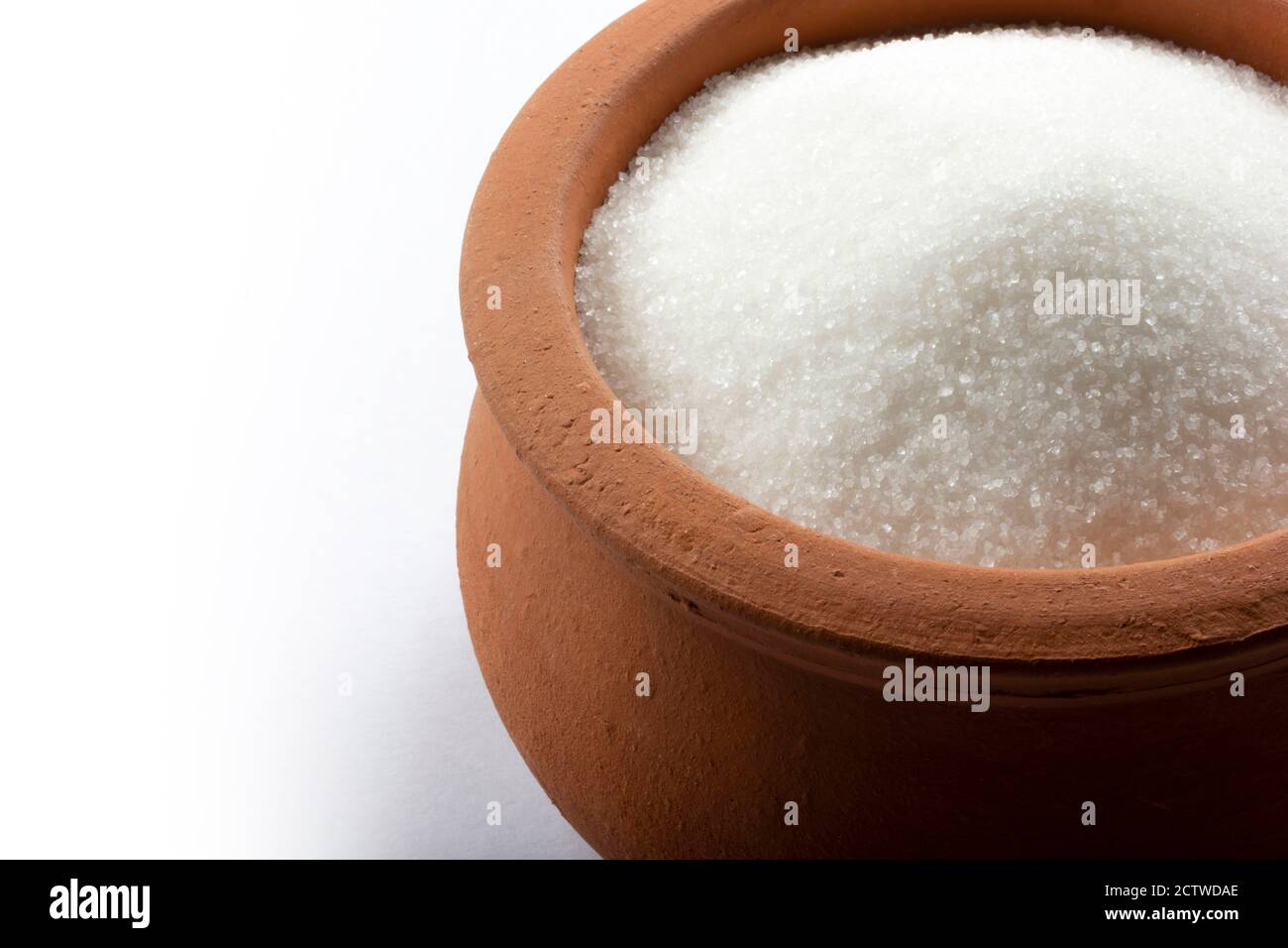 Granulated sugar in bowl. Crystals of refined table sugar. Sweet ...