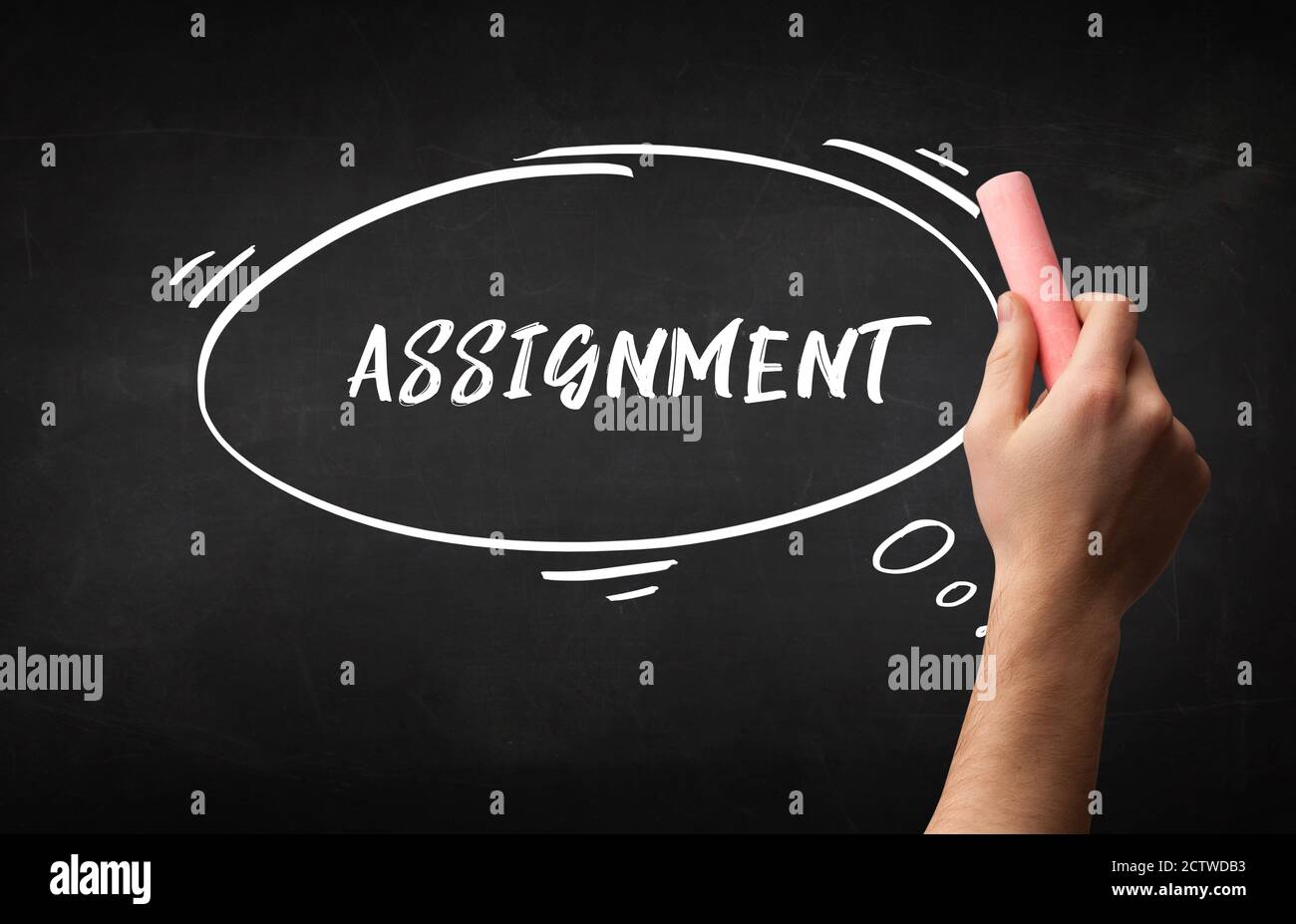 Hand drawing ASSIGNMENT inscription with white chalk on blackboard ...