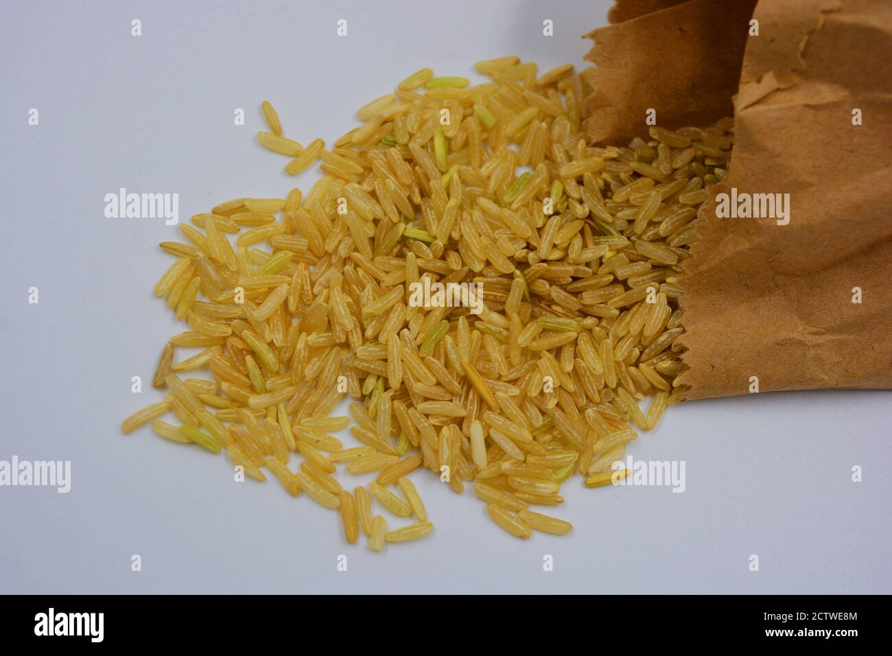 Delicious healthy white yellow wild unpolished long rice sprinkled from ...