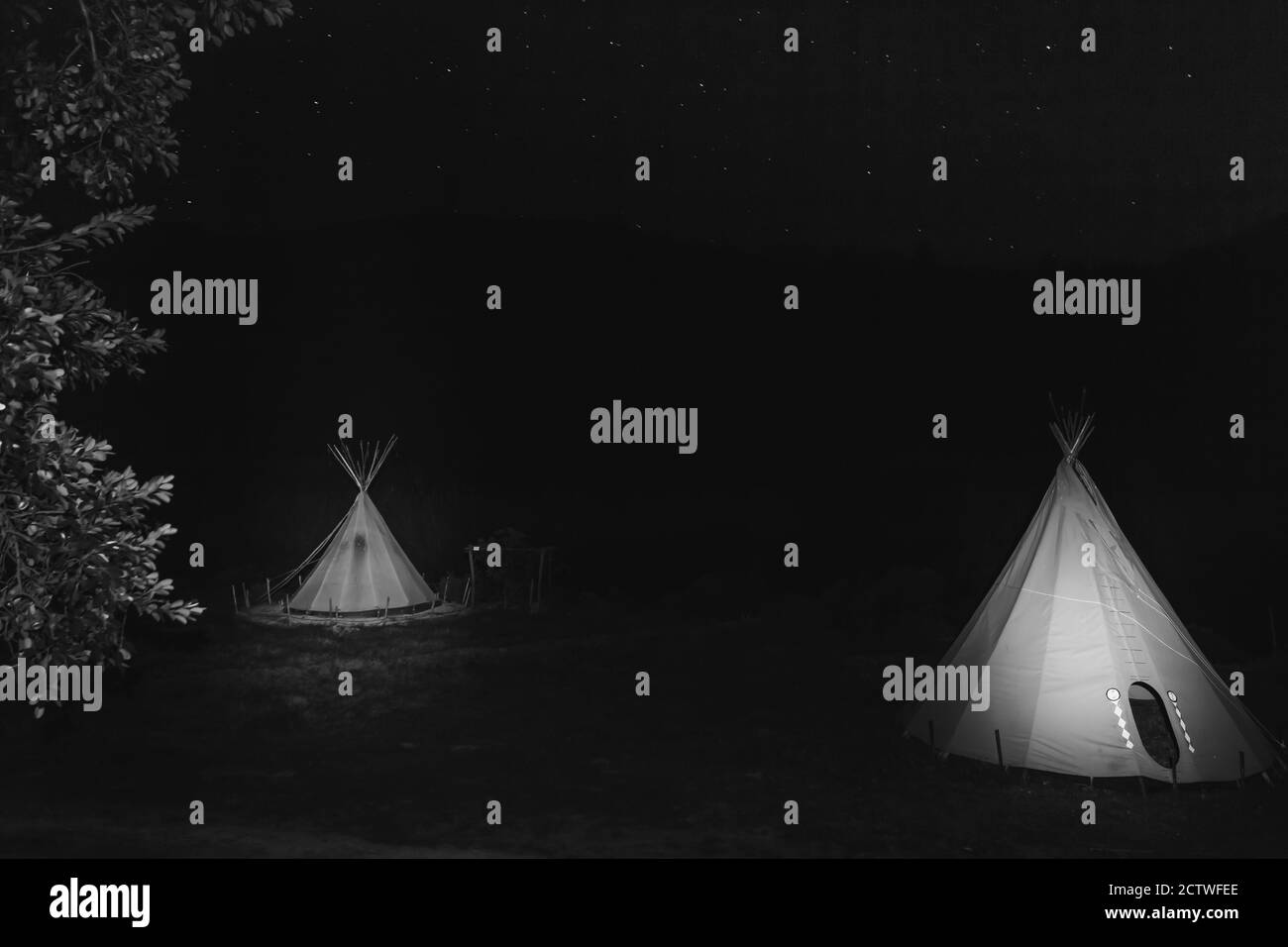 Two Tipi tents at night Stock Photo - Alamy