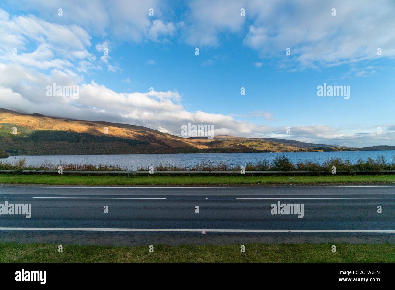 Paved highway going through beautiful nature scenes Stock Photo - Alamy