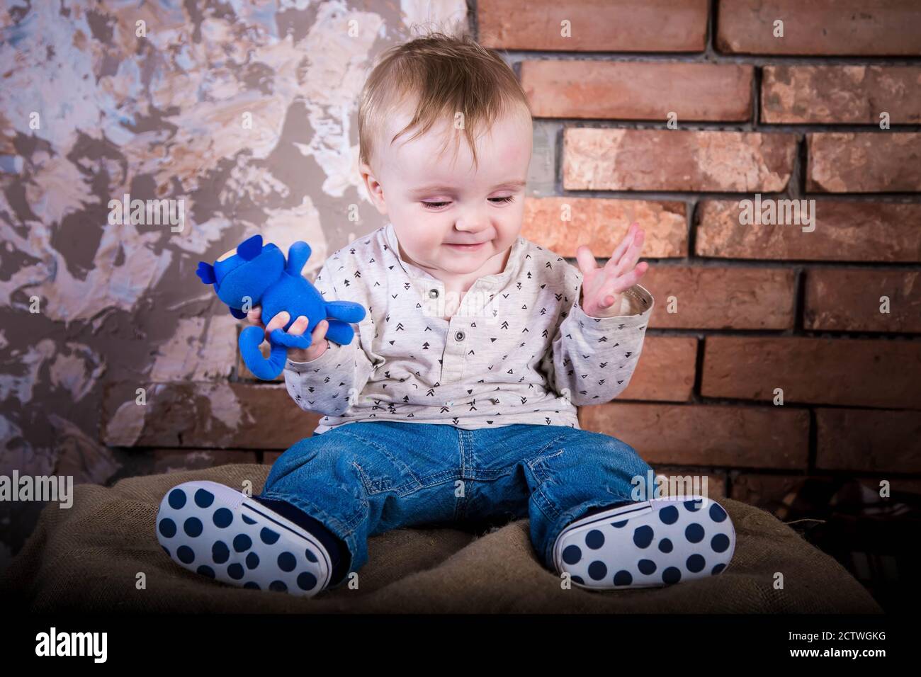 Small baby boy is confused and does not understand what is happening ...