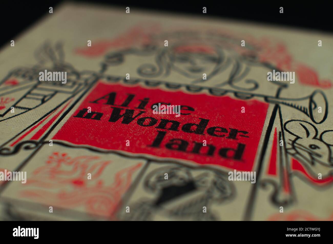 Alice in wonderland book cover hi-res stock photography and images - Alamy