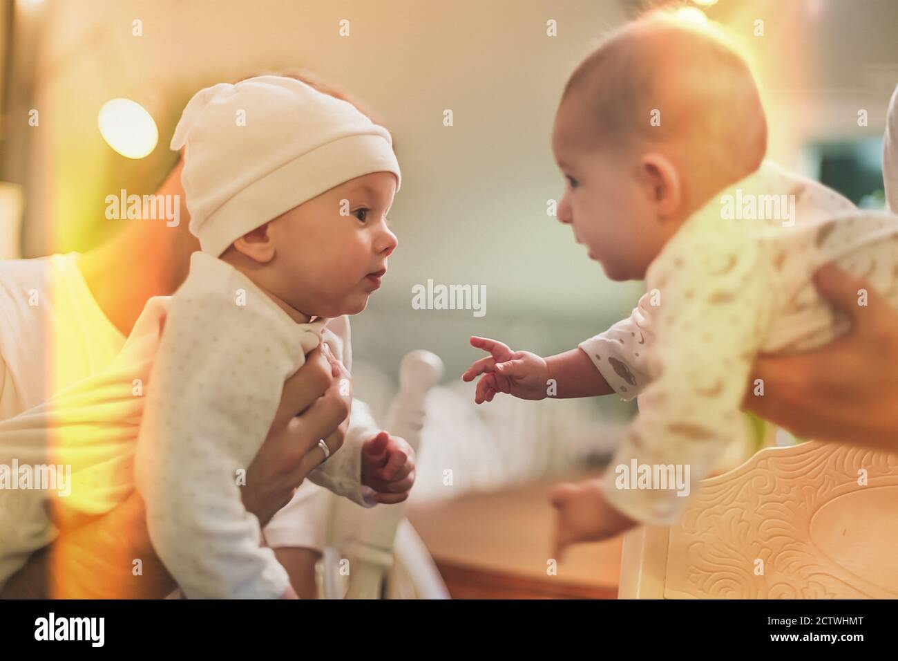 The first friend of the baby. Two babies are very interested in each ...