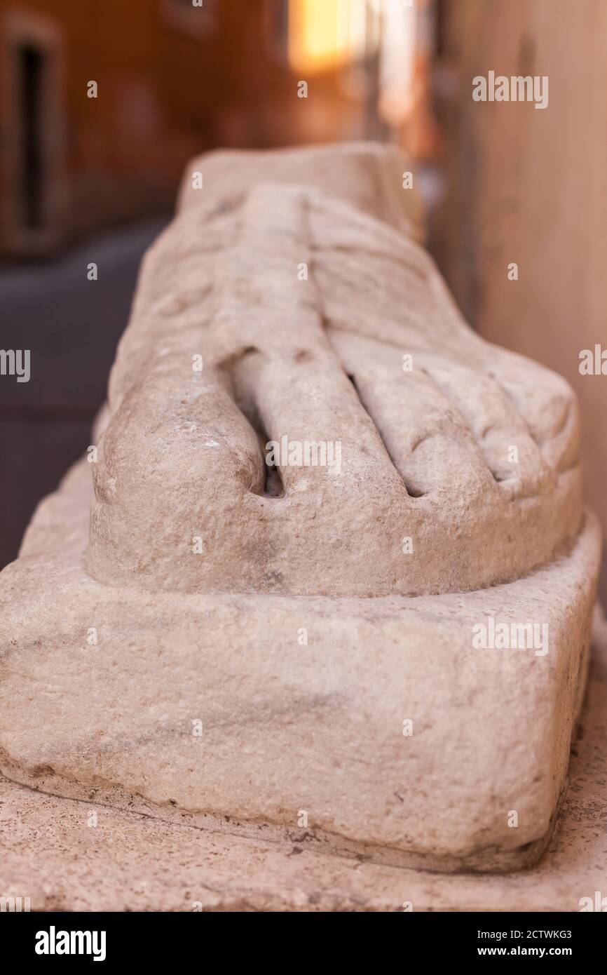 ROME, ITALY - 2014 AUGUST 21. Sculpture of a foot in the walking street ...