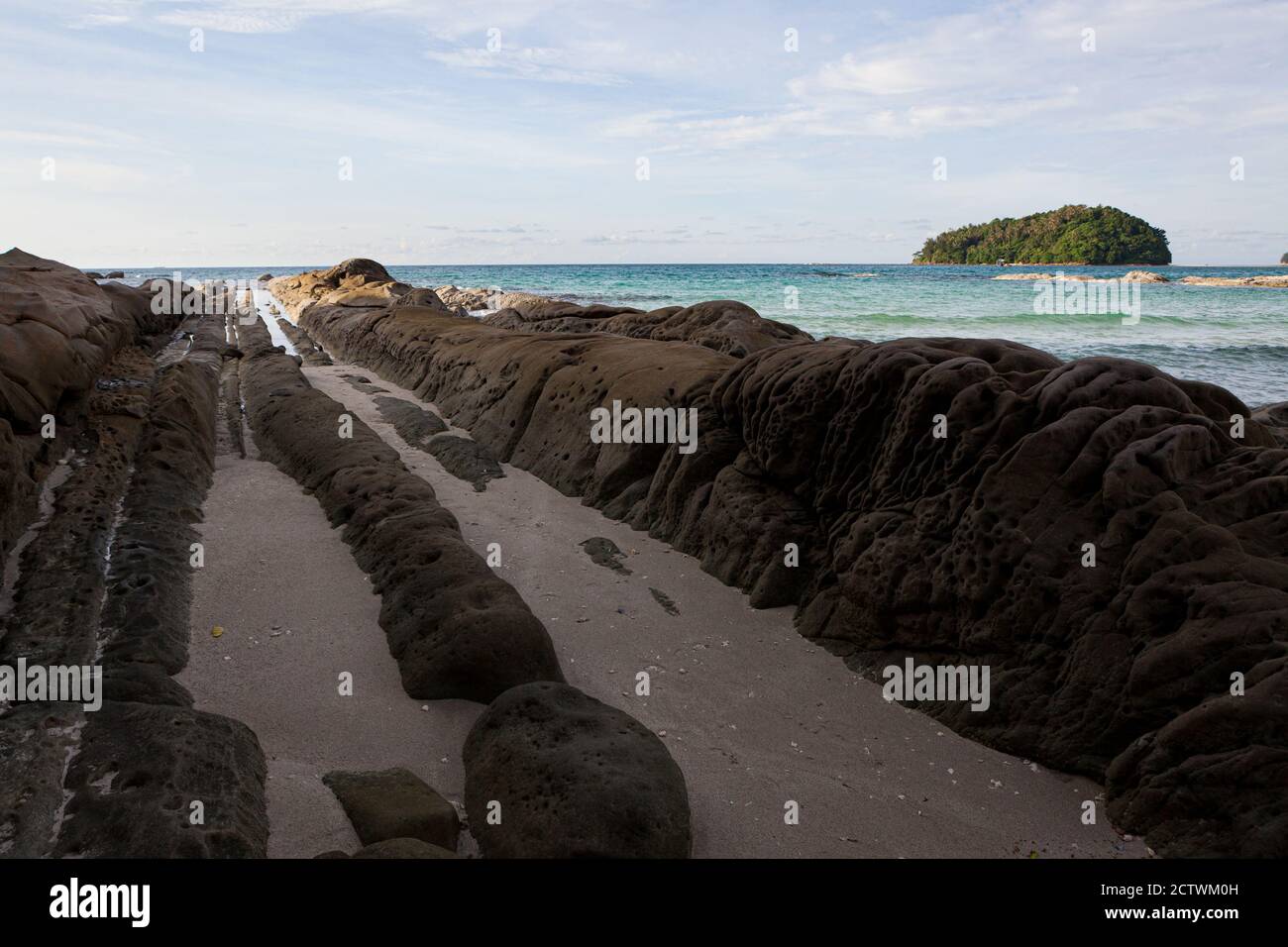 Smooth long rocks beach borneo malaysia Stock Photo - Alamy