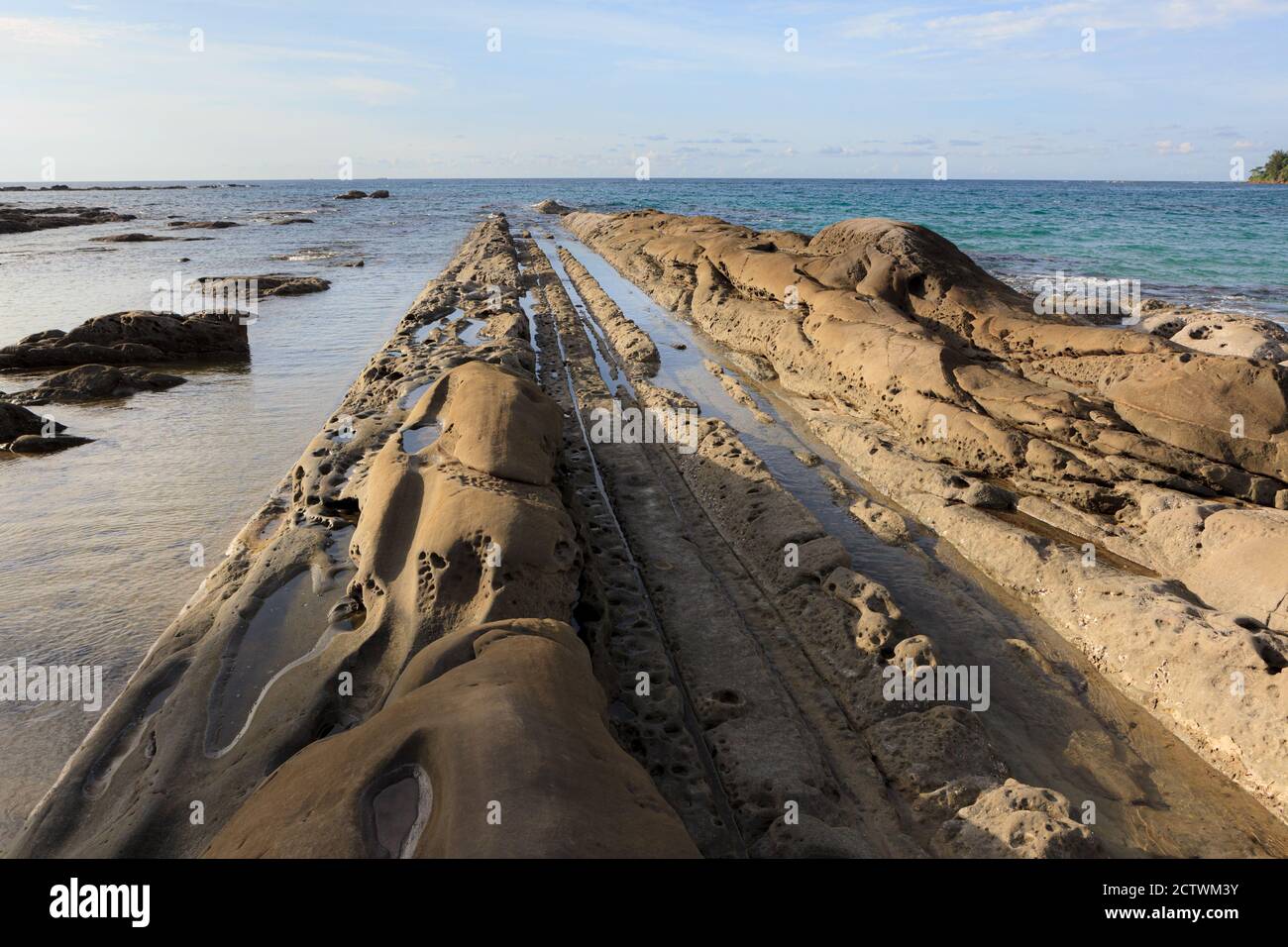 Smooth long rocks beach borneo malaysia Stock Photo - Alamy