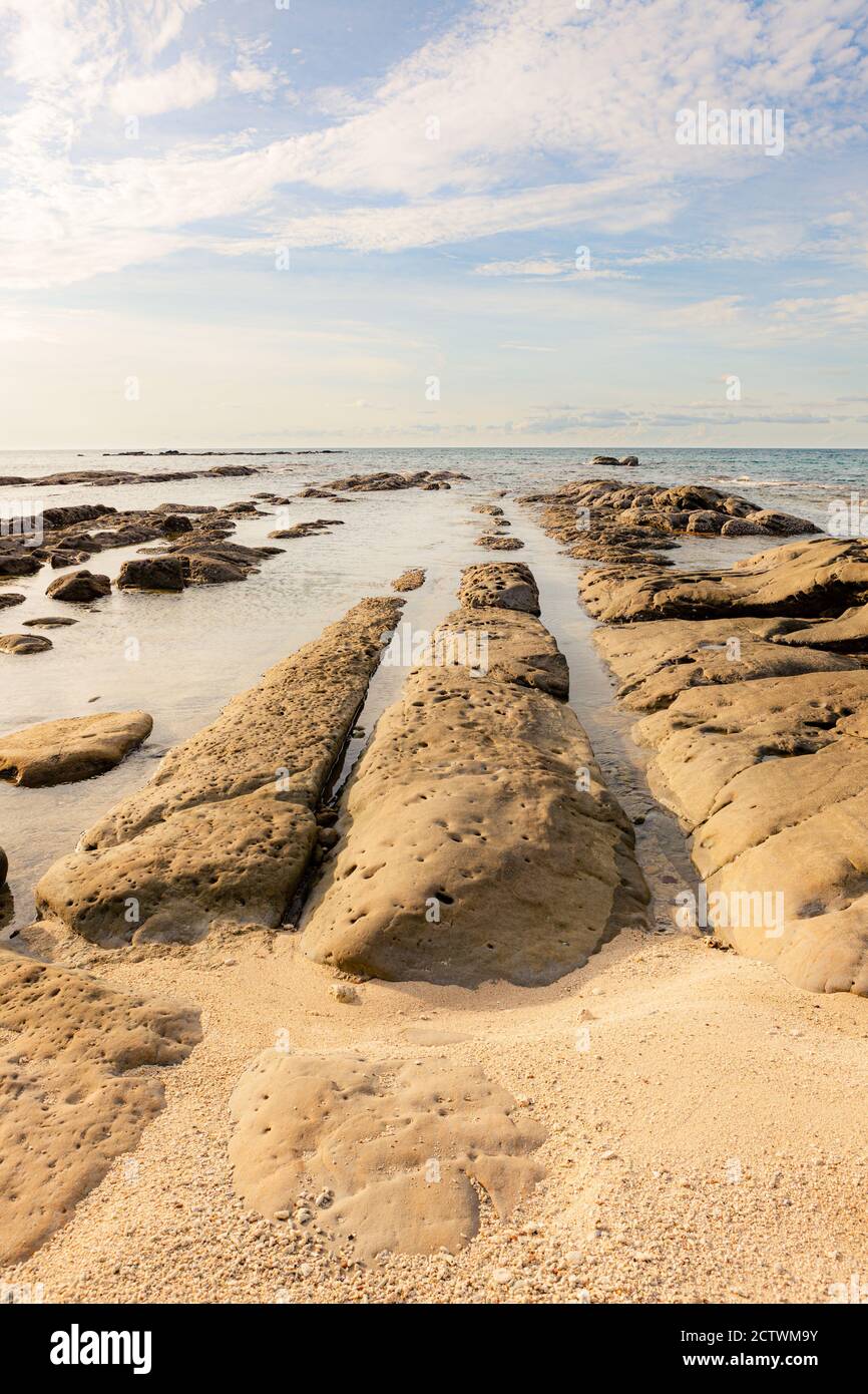 Smooth long rocks beach borneo malaysia Stock Photo - Alamy