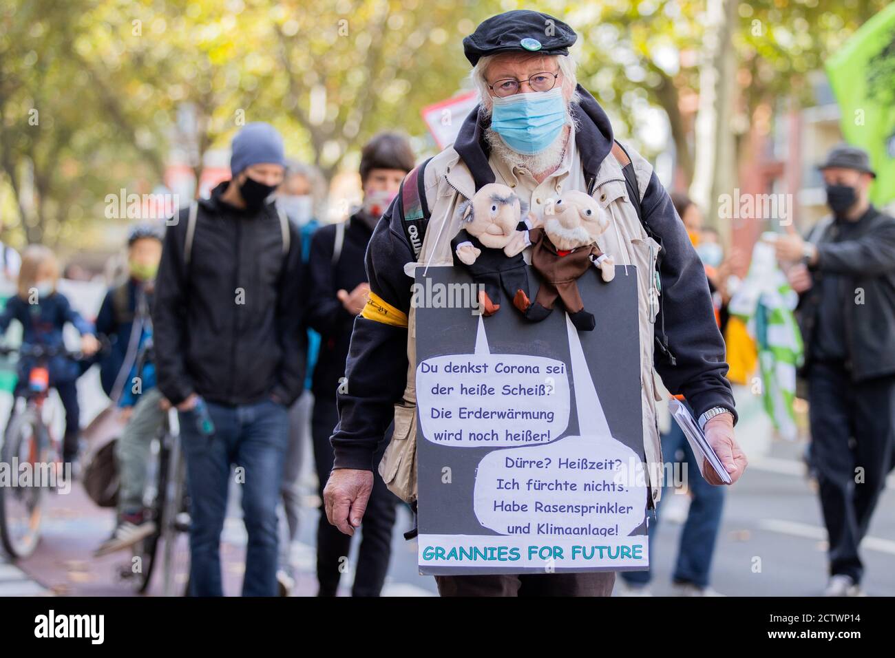 Cologne, Germany. 25th Sep, 2020. An activist with a sign that deals ...
