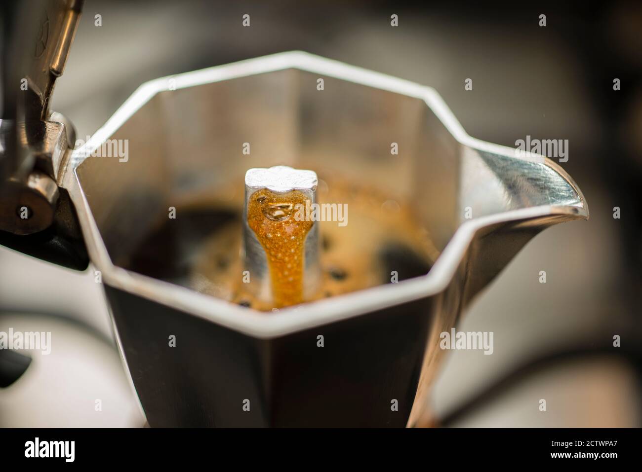 Traditional italian moka machine with fresh hot coffee coming up Stock ...