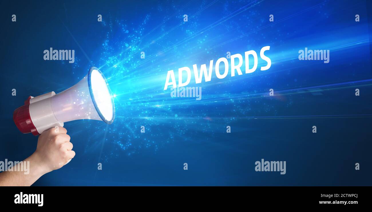 Young person shouting in loudspeaker with ADWORDS inscription, business ...