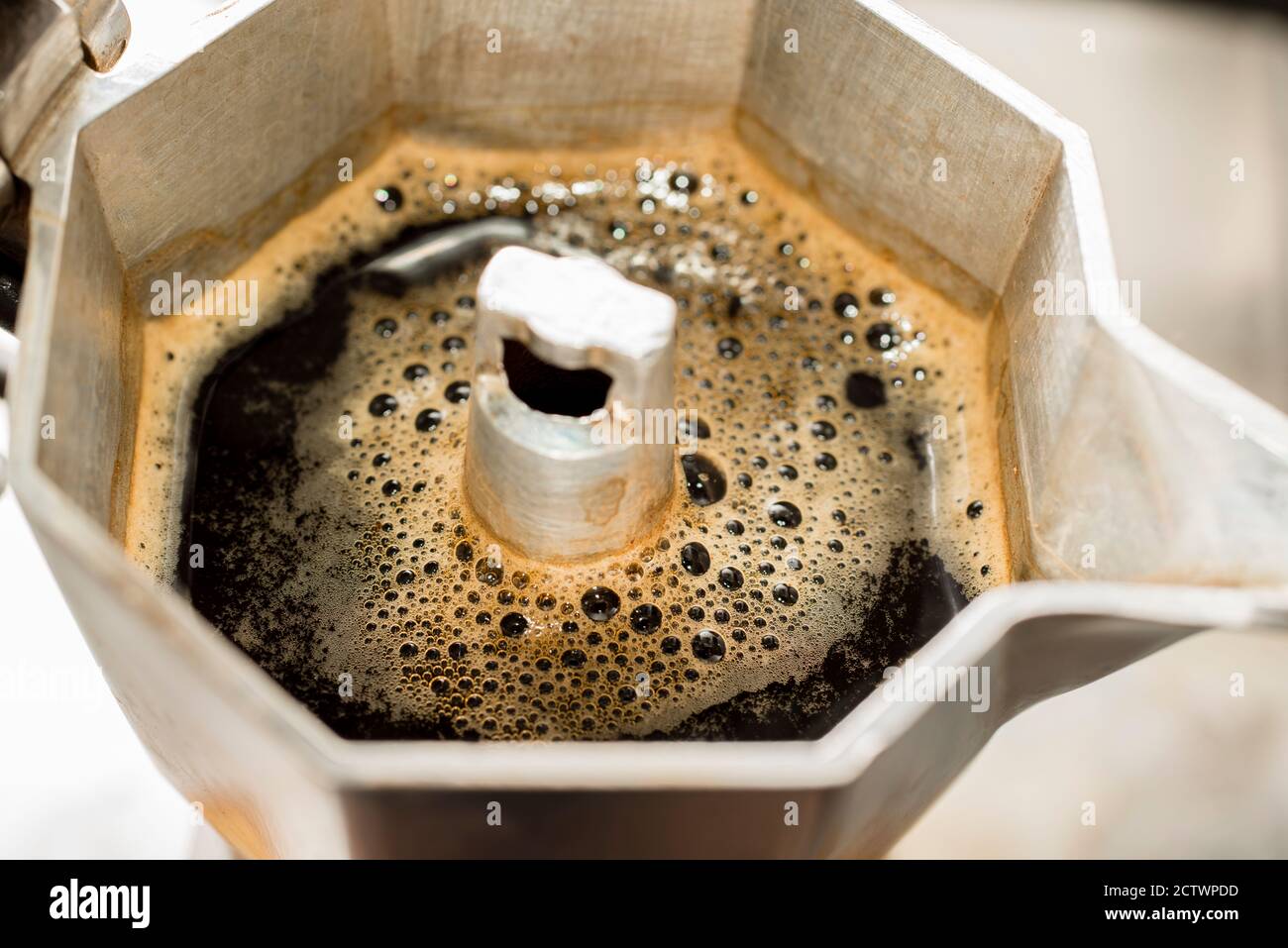 Traditional italian moka machine with fresh hot coffee coming up Stock ...