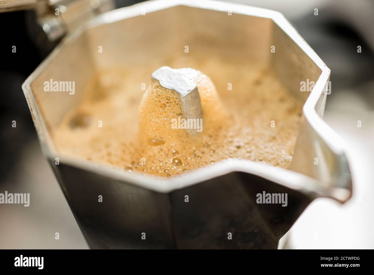 Traditional italian moka machine with fresh hot coffee coming up Stock ...