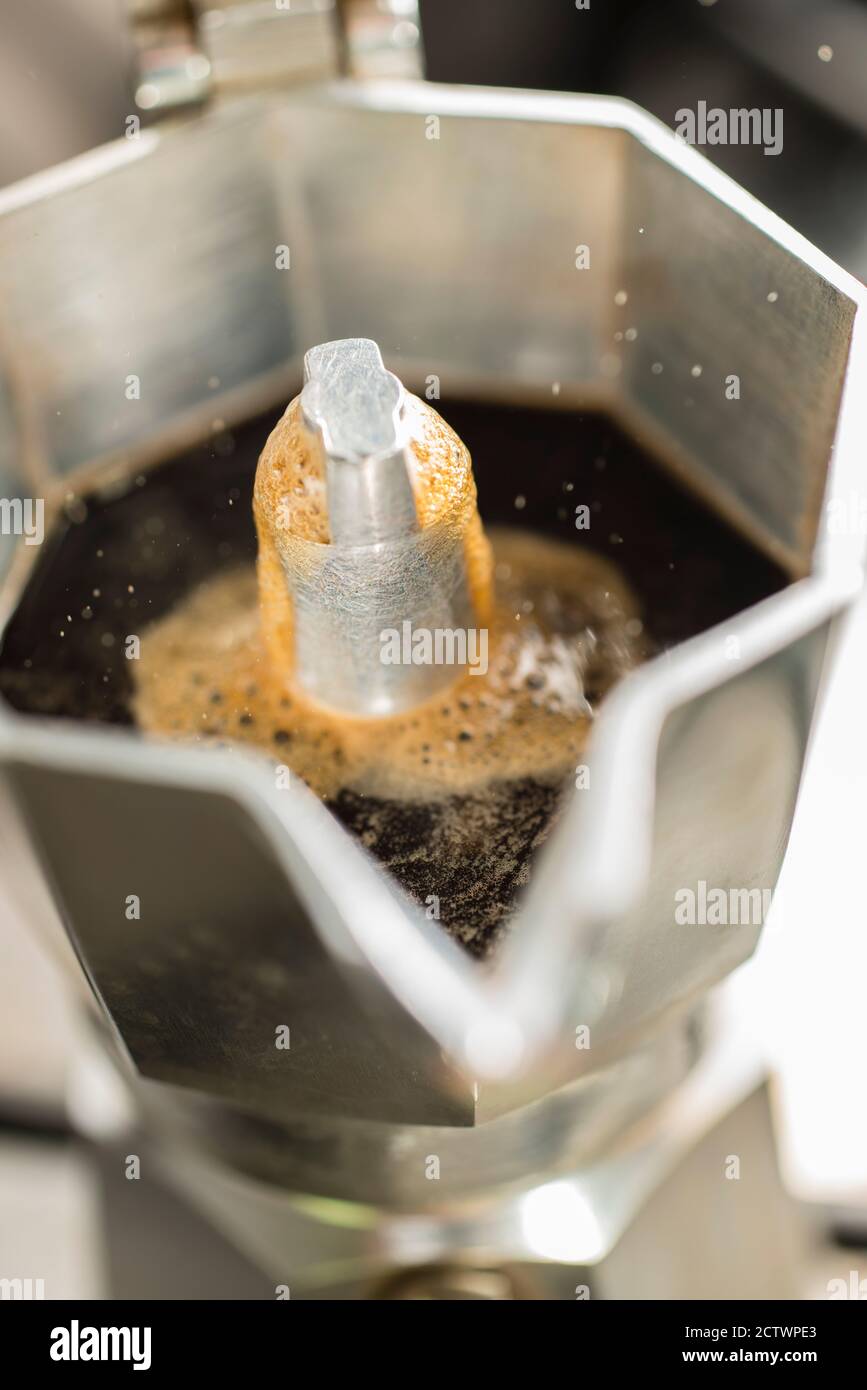 Traditional italian moka machine with fresh hot coffee coming up Stock ...