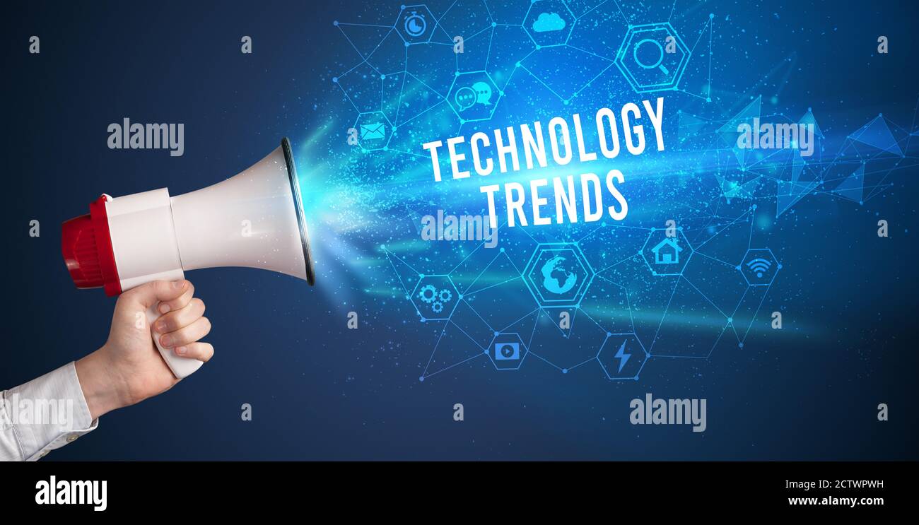 Young woman shouting in megaphone with TECHNOLOGY TRENDS inscription ...
